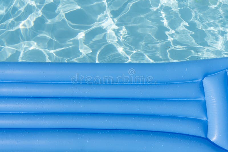 Bright Blue Summer Pool Lounger Float on a Rippled Swimming Pool Stock ...