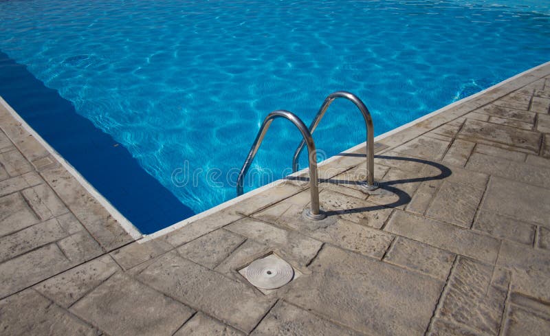 Bright blue swimming pool stock photo. Image of season - 28725468