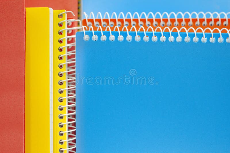 Bright Blue, Yellow and Orange Notebooks on a Spring, and Business ...