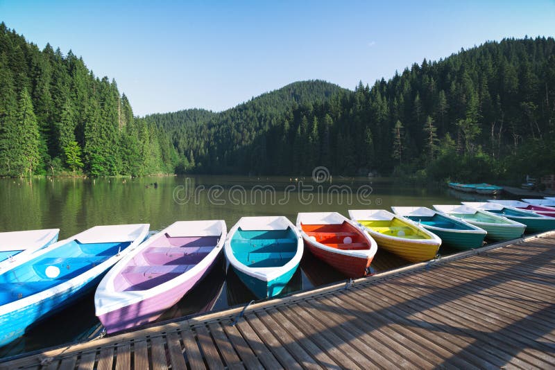 Bright Boats on a Mountain Lake Stock Photo - Image of leisure, lake ...