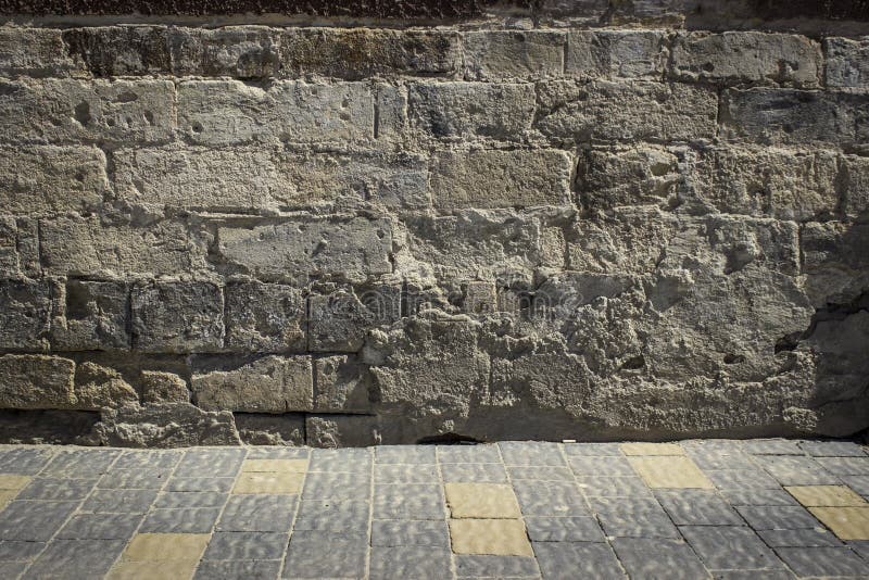 Bright Brick Wall with Pavement Stones , Background Texture Stock Photo ...