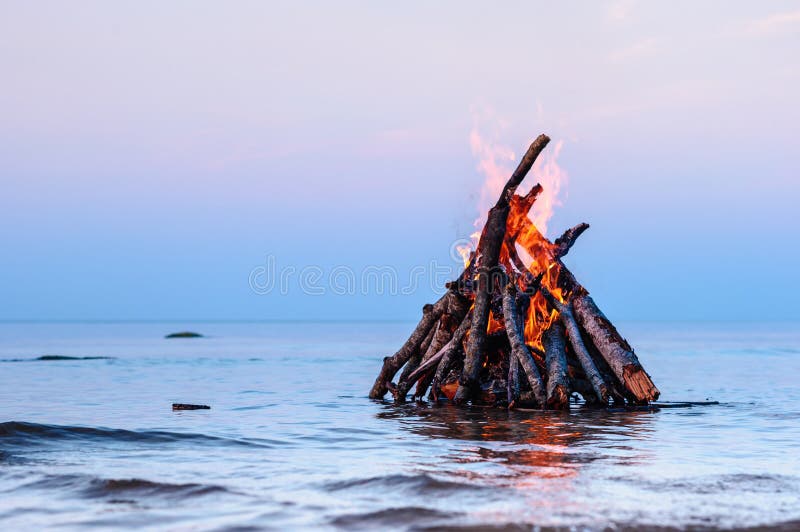 Bright campfire at sunset stock image. Image of horizon - 62412709