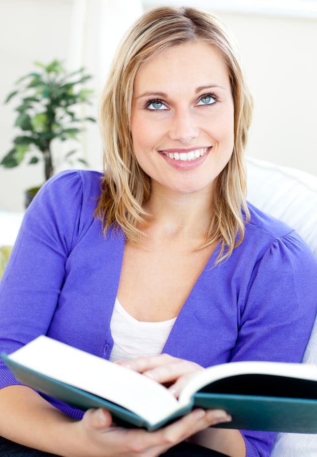 Bright Caucasian Woman Reading a Book on the Sofa Stock Photo - Image ...
