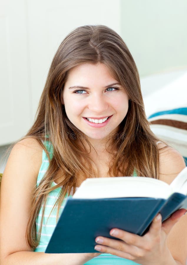 Bright Caucasian Woman Reading a Book on the Sofa Stock Photo - Image ...
