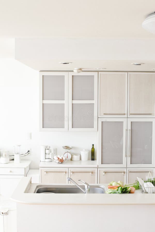 A Bright, Clean White Kitchen with a Compact Stock Image - Image of ...