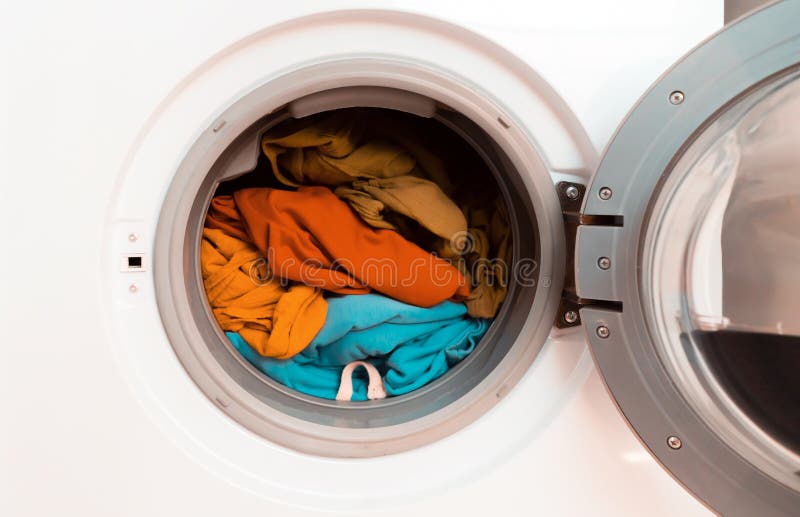 Bright Clothes Inside Washing Machine. Stock Image - Image of ...