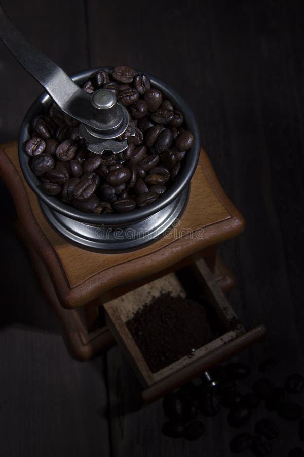 Bright Coffee Grains in the Old Coffee Grinder Stock Photo - Image of ...