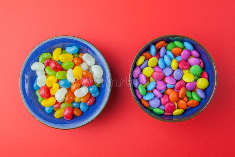 Bright Color Candy Sweets in Bowl on Red Background Stock Image - Image ...