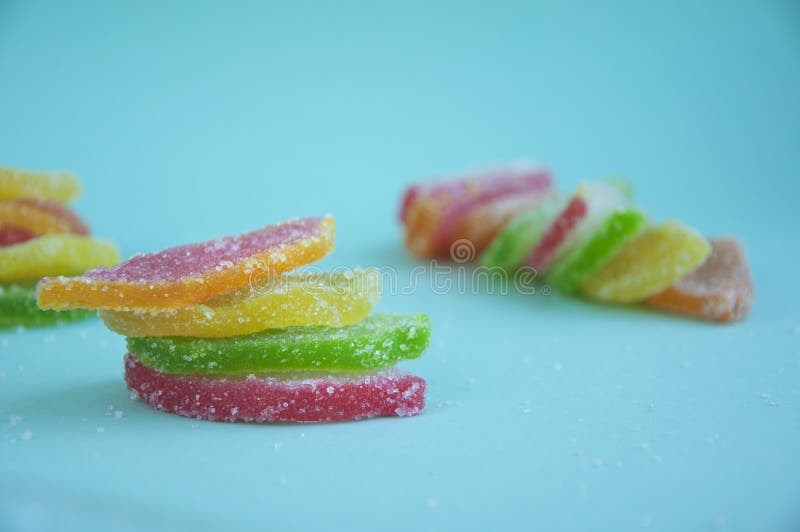Bright Colored Gelatin Candy on a Blue Background. Marmalade in Sugar ...