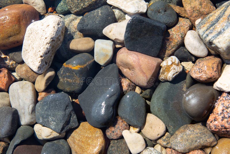 Bright colored sea pebbles stock image. Image of colored - 144978155