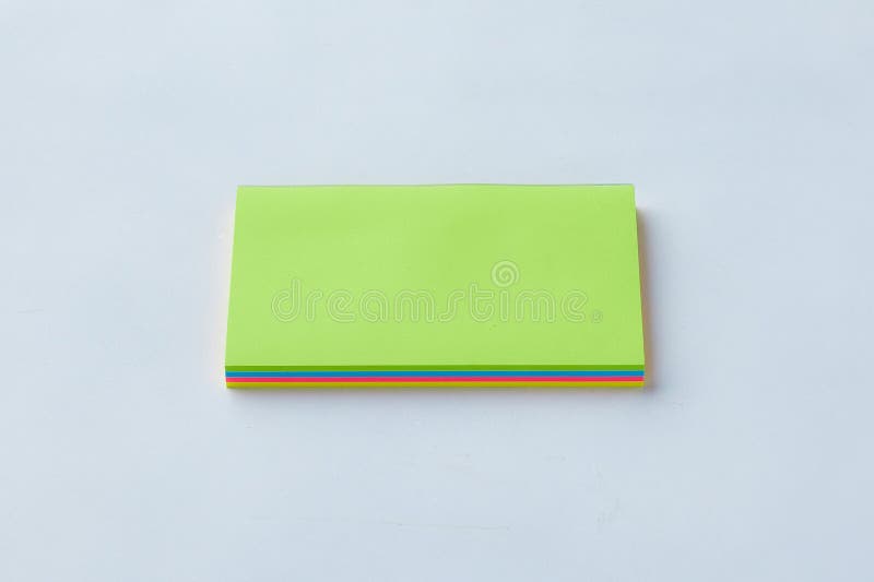 Bright Colored Sticky Notes Stacked Neatly on a Plain White Surface ...