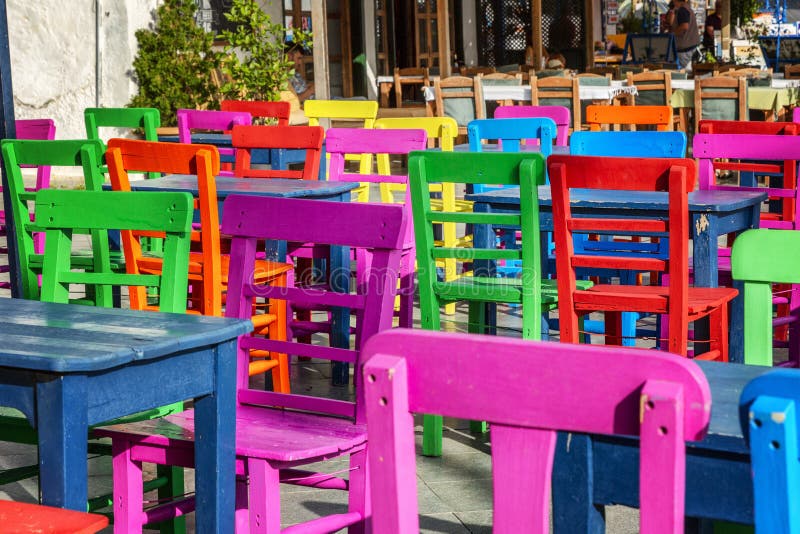 Bright Colored Wooden Chairs in an Outdoor Cafe Stock Photo - Image of ...