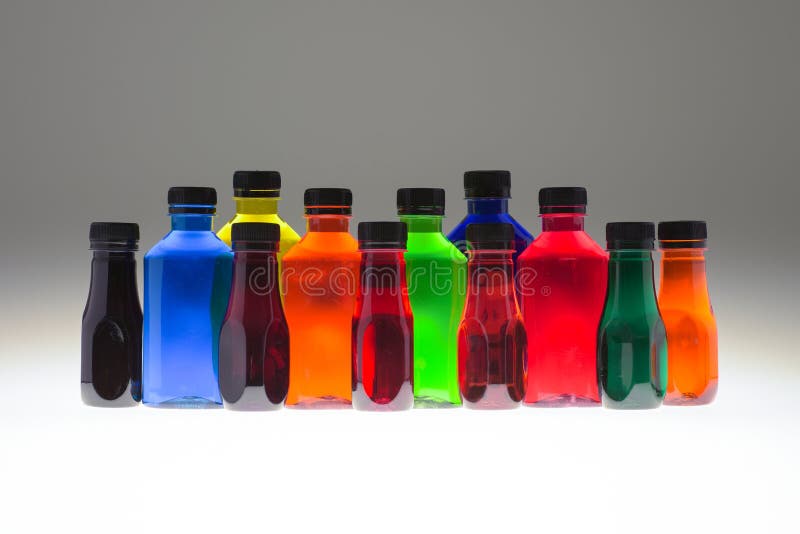Bright Coloured Plastic Bottles with Colourful Liquid Showing Colour ...
