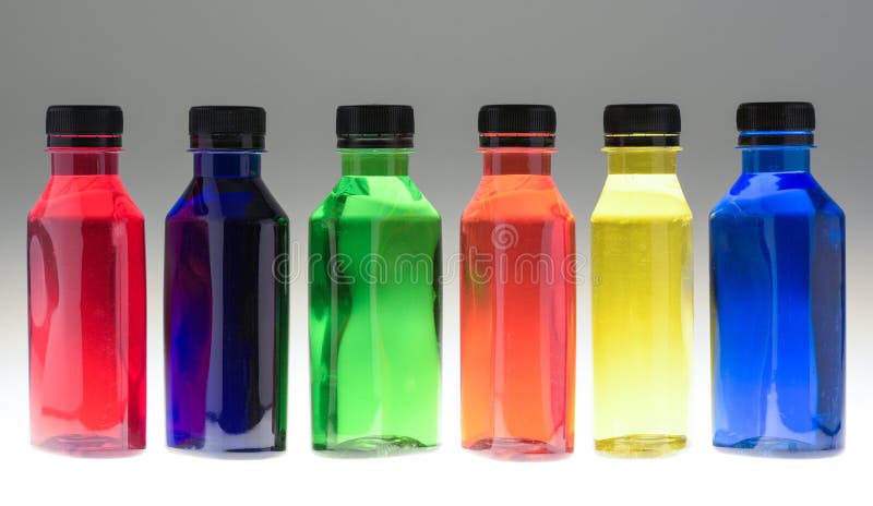 Bright Coloured Plastic Bottles with Colourful Liquid Showing Colour ...
