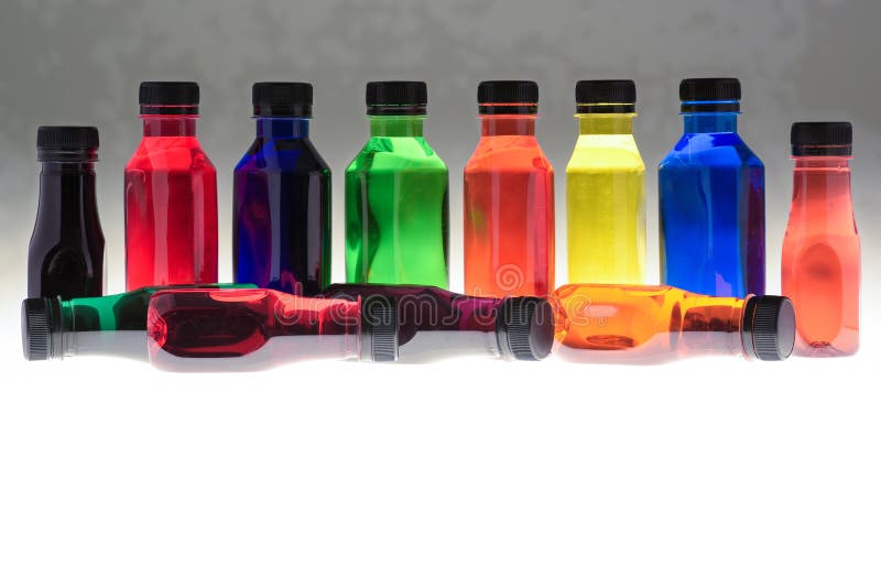 Bright Coloured Plastic Bottles with Colourful Liquid Showing Colour ...