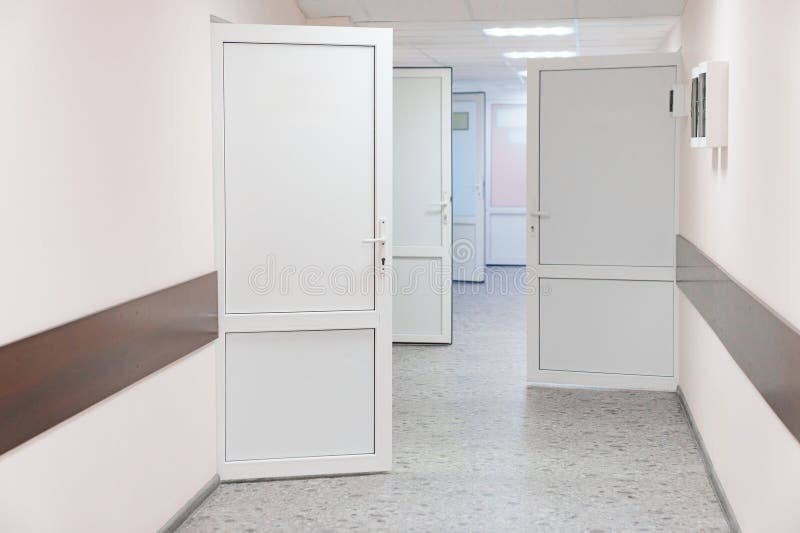 A Bright Corridor with Open White Doors. Hospital Premises Stock Image ...