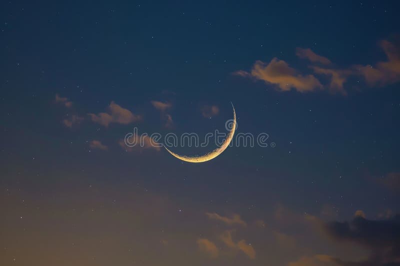 A Bright Crescent Moon is Visible in the Night Sky, Illuminating the ...