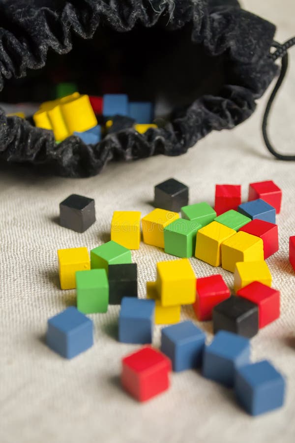 Bright Cubes Fall Out of the Black Bag. Colored Cubes in a Black Bag ...