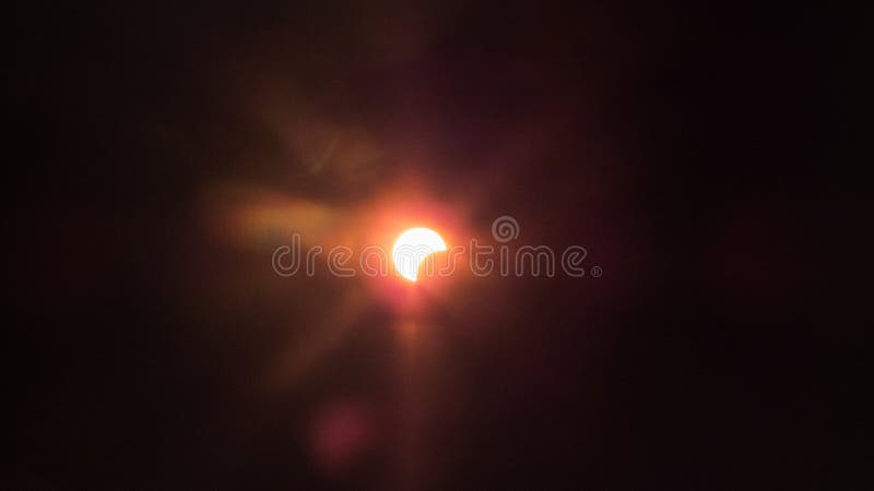 Bright and Distant Partial Solar Eclipse Stock Image - Image of orbit ...