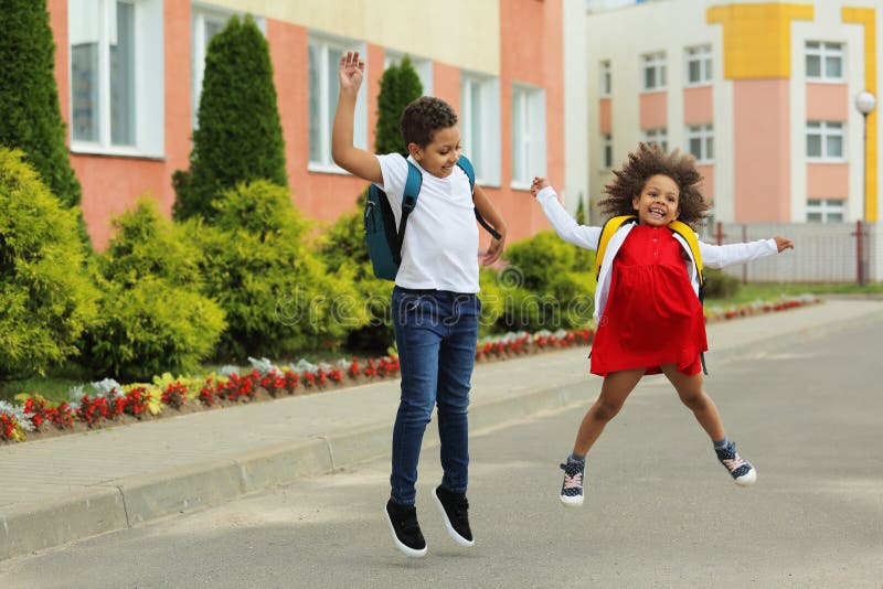 Bright Emotions of Two Black Children Running and Jump Back To School ...