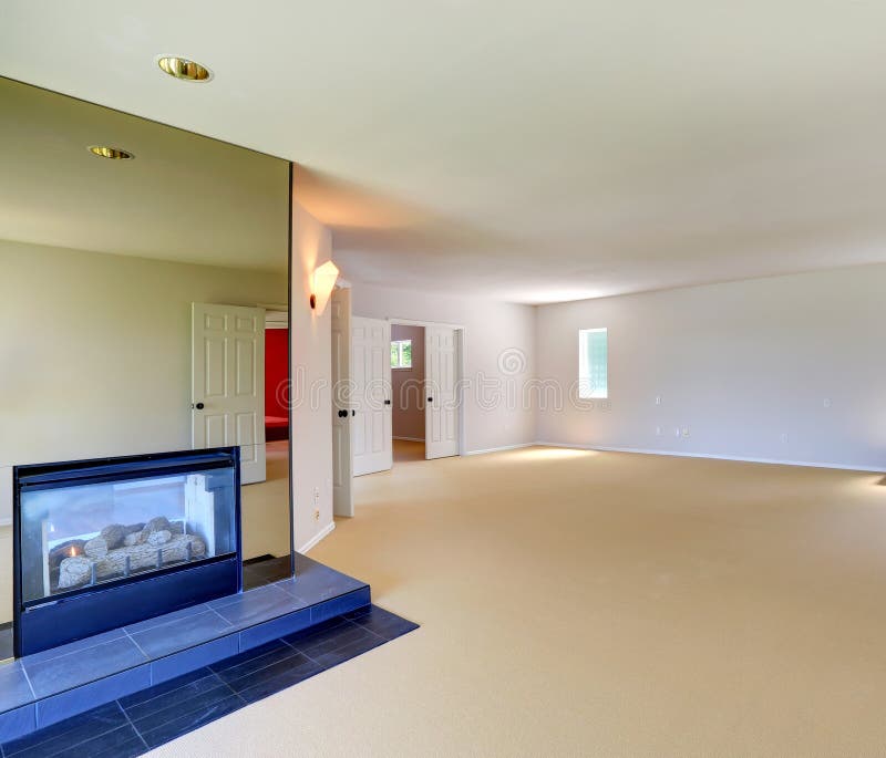 Bright Empty Room with Fireplace and Mirror Trim Stock Photo - Image of ...