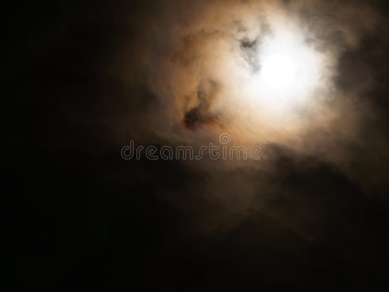 Bright Energy of the Moon Shines through the Clouds Stock Photo - Image ...
