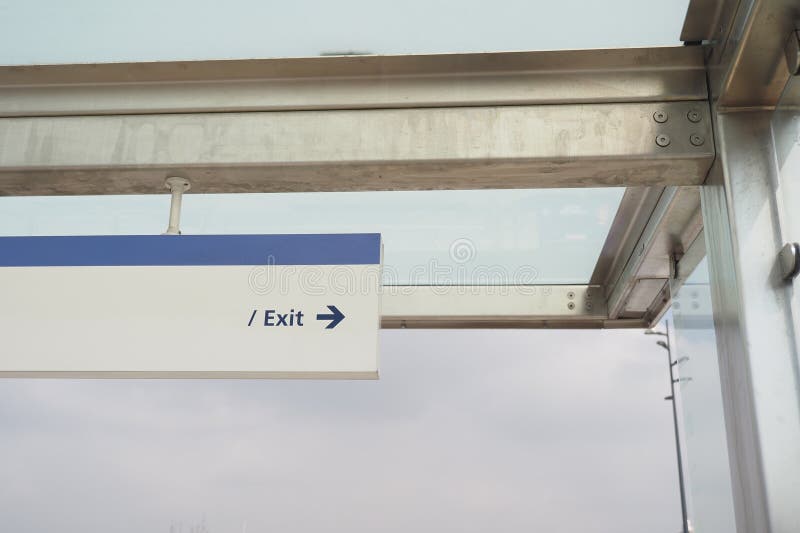 Bright Exit Sign Clearly Indicating Direction at a Contemporary and ...