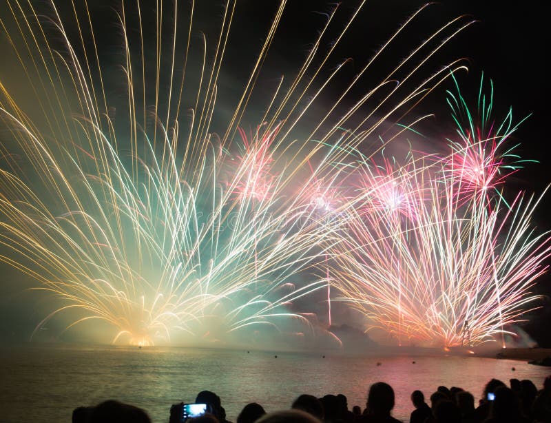Bright Firework Show Over Water in Dark Sky Stock Image - Image of ...