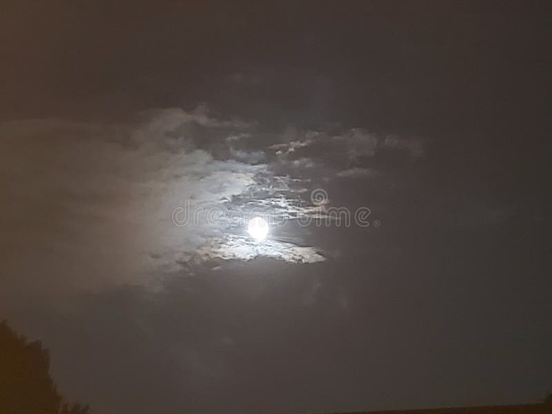 Bright Full Moon Behind Clouds Stock Photo - Image of night, clouds ...