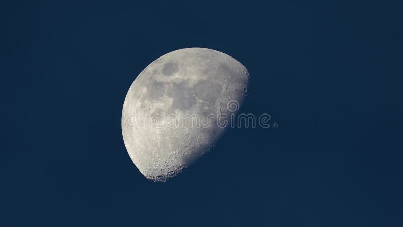 Bright Full Moon Behind Fast Moving Thin Layer of Clouds on Night Blue ...