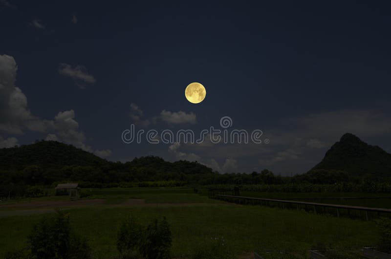 Bright Full Moon Over the Field and Mountains in the Evening Stock ...