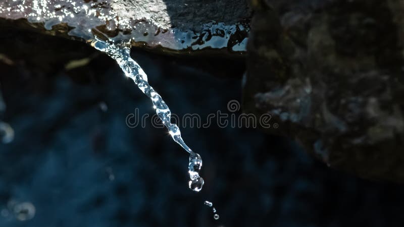 Bright Glint of Sunlight Reflecting from a Thin Stream of Water Stock ...