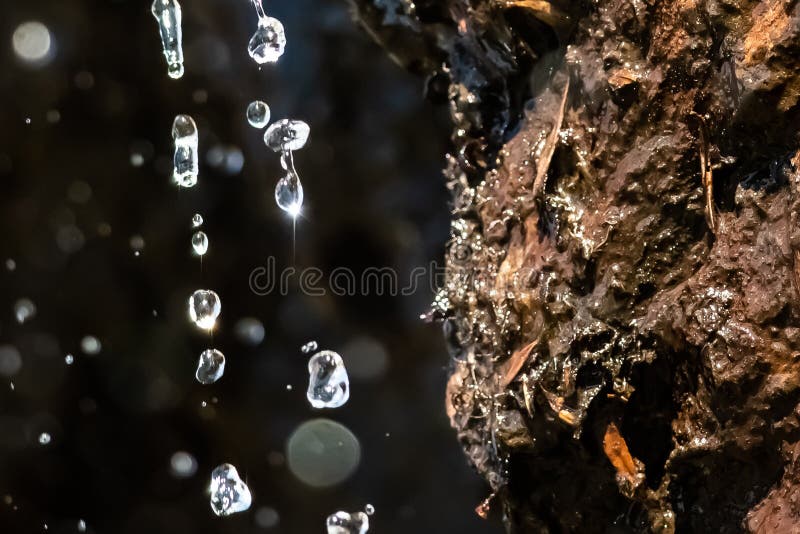 Bright Glint of Sunlight Reflecting from a Thin Stream of Water Stock ...