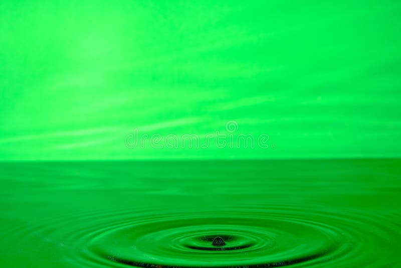 Bright Green Background with Diverging Circles from Dropped Drop on ...