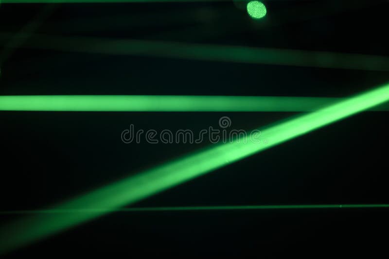 Bright Green Neon Laser Lights Illuminate the Darkness Creating Lines ...
