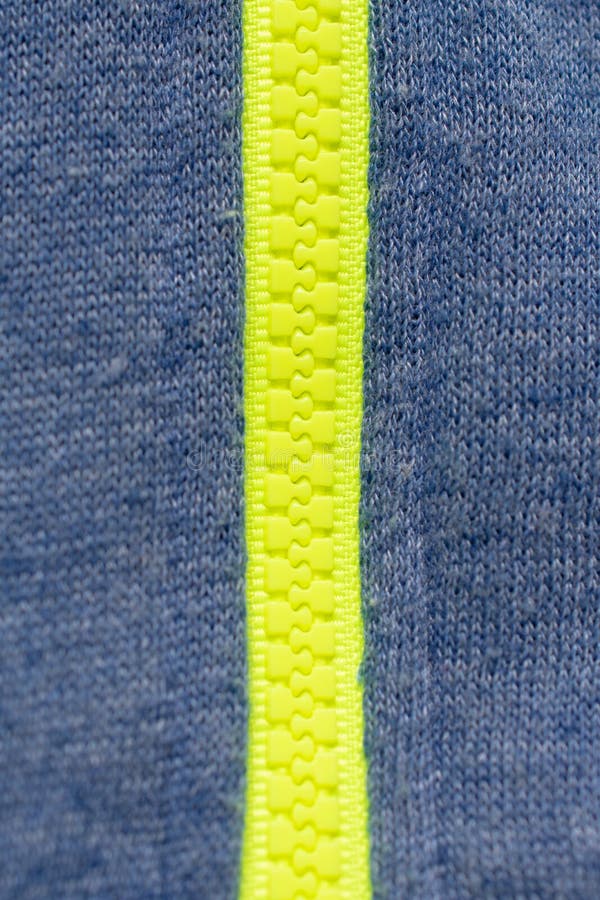 Blue Plastic Zipper Closed in the Middle of a Blue Fabric Texture, from ...