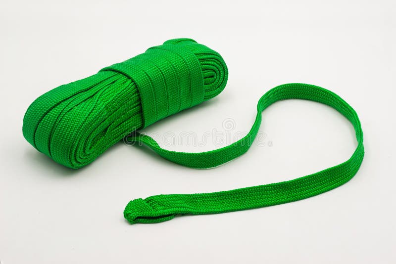 Bright Green Rope Coiled Neatly with One End Extended for Various Uses ...
