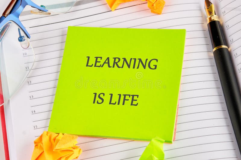Bright Green Sticky Note Stating Learning is Life Placed on Lined Paper ...