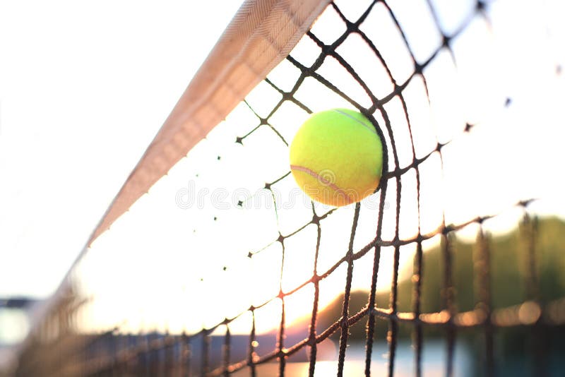 Bright Greenish Yellow Tennis Ball Hitting the Net Stock Photo - Image ...