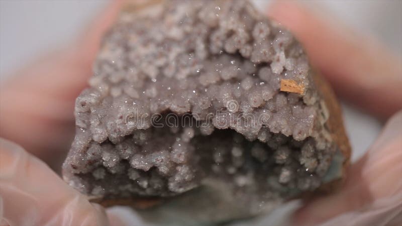 Bright Grey Ruby Crystal Ore in Hands with Gloves. Crystallization is ...