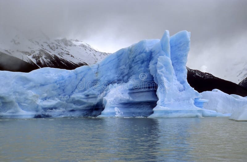A Bright Iceberg in Bad Weather Conditions Stock Photo - Image of large ...