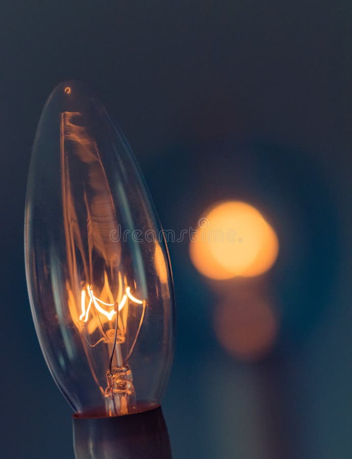 Orange Glow of Incandescent Light Bulb on Low Power in Home Stock Image ...