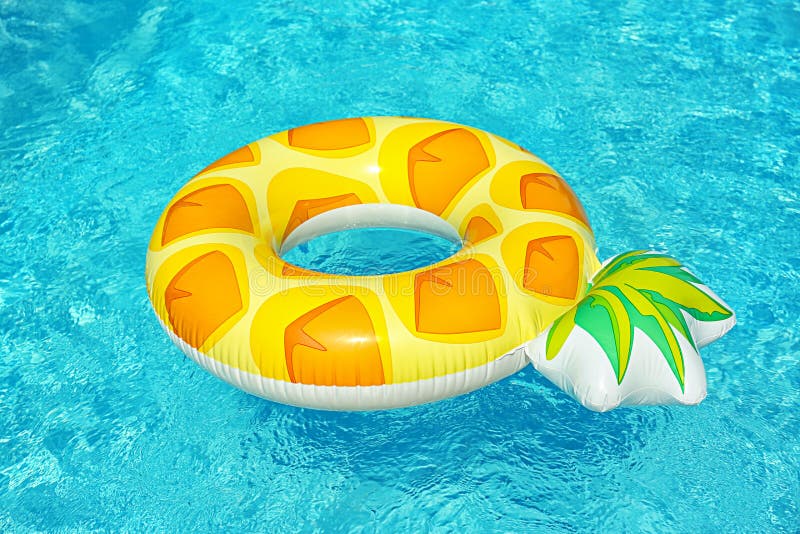 Inflatable Pineapple Floating in Sea. Close Up Shot of Rubber Ring with ...