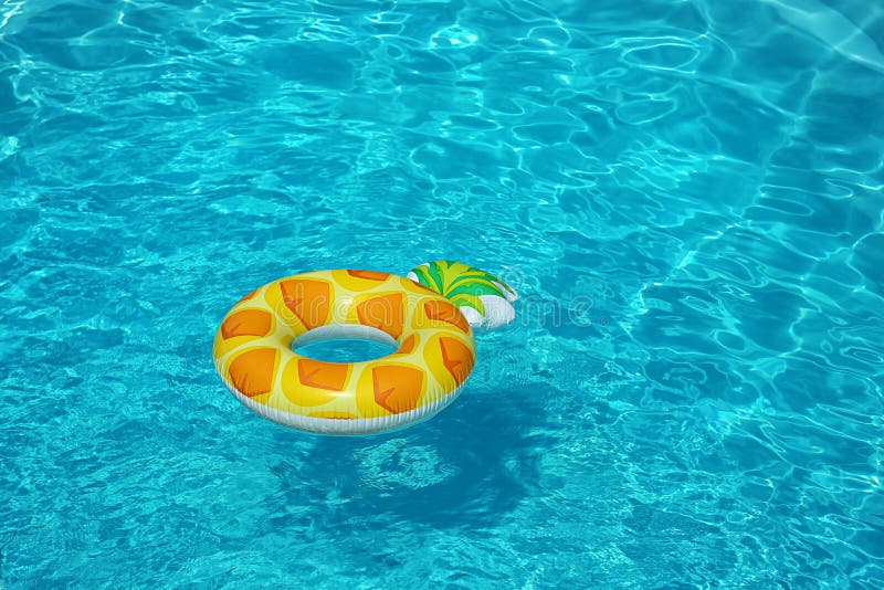 Inflatable Pineapple Floating in Sea. Close Up Shot of Rubber Ring with ...