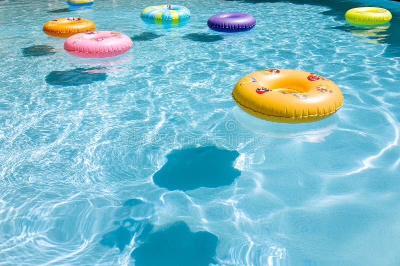 Bright Inflatable Toys in Various Colors Float on the Surface of a ...