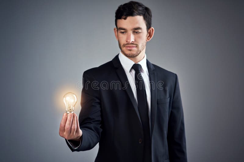 Bright, Innovation and Businessman with Light Bulb in Studio for Ideas ...