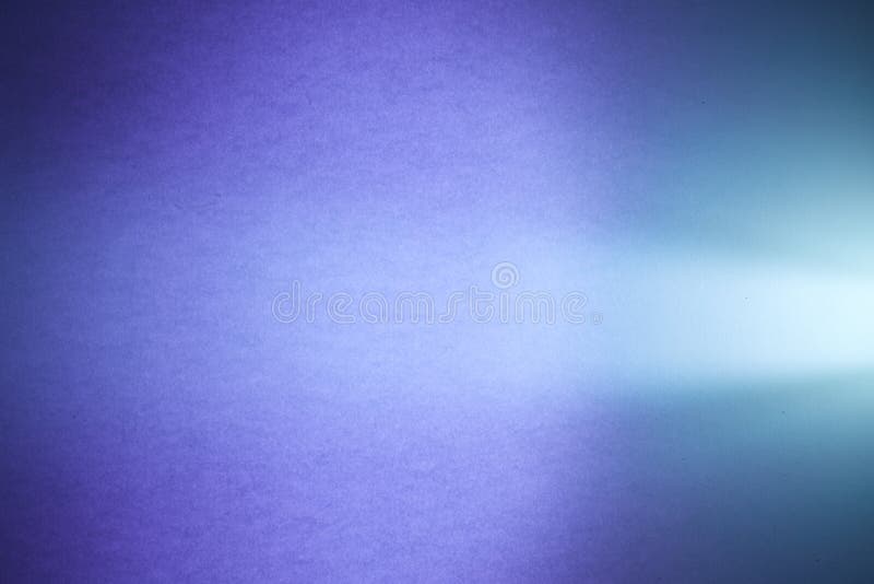Bright Light Blue Ray of Light Dissects a Blurred Blue Background and a ...