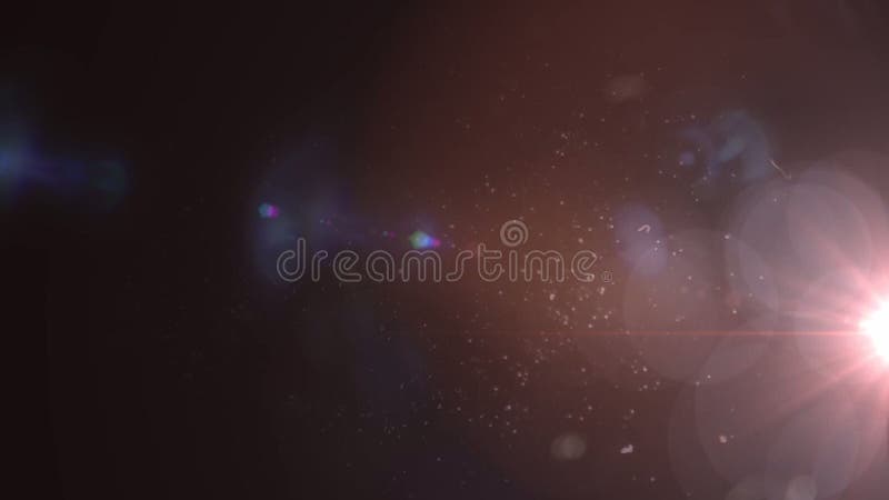 Bright Light Lens Flare Effect Transitioning on Black Background Stock ...