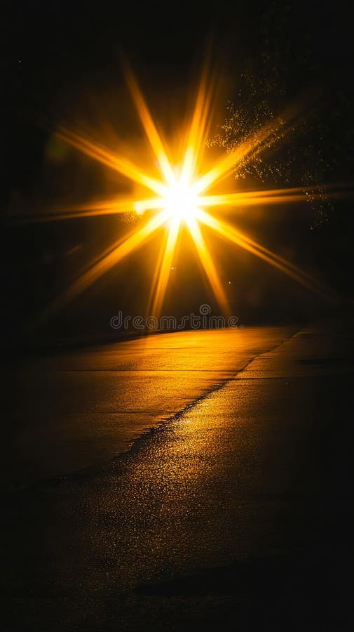 A Bright Light Shines Brightly on a Dark Road at Night Stock Photo ...