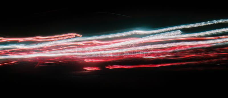 Bright Light Trails Create Dynamic Motion Against a Black Background ...